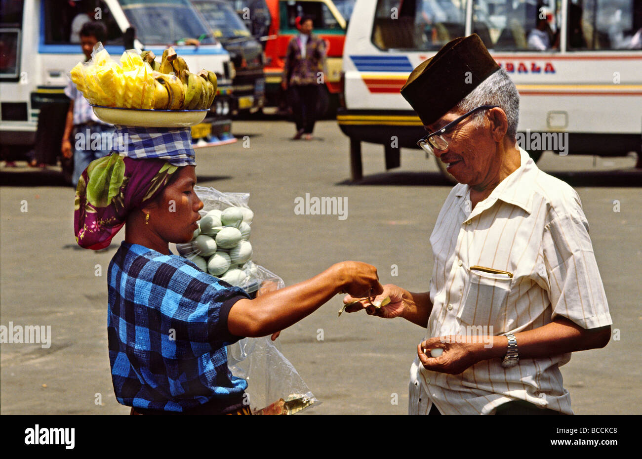 Indonesia, Sumatra, Bukittinggi, eggs and fruits dealer on bus stand ...