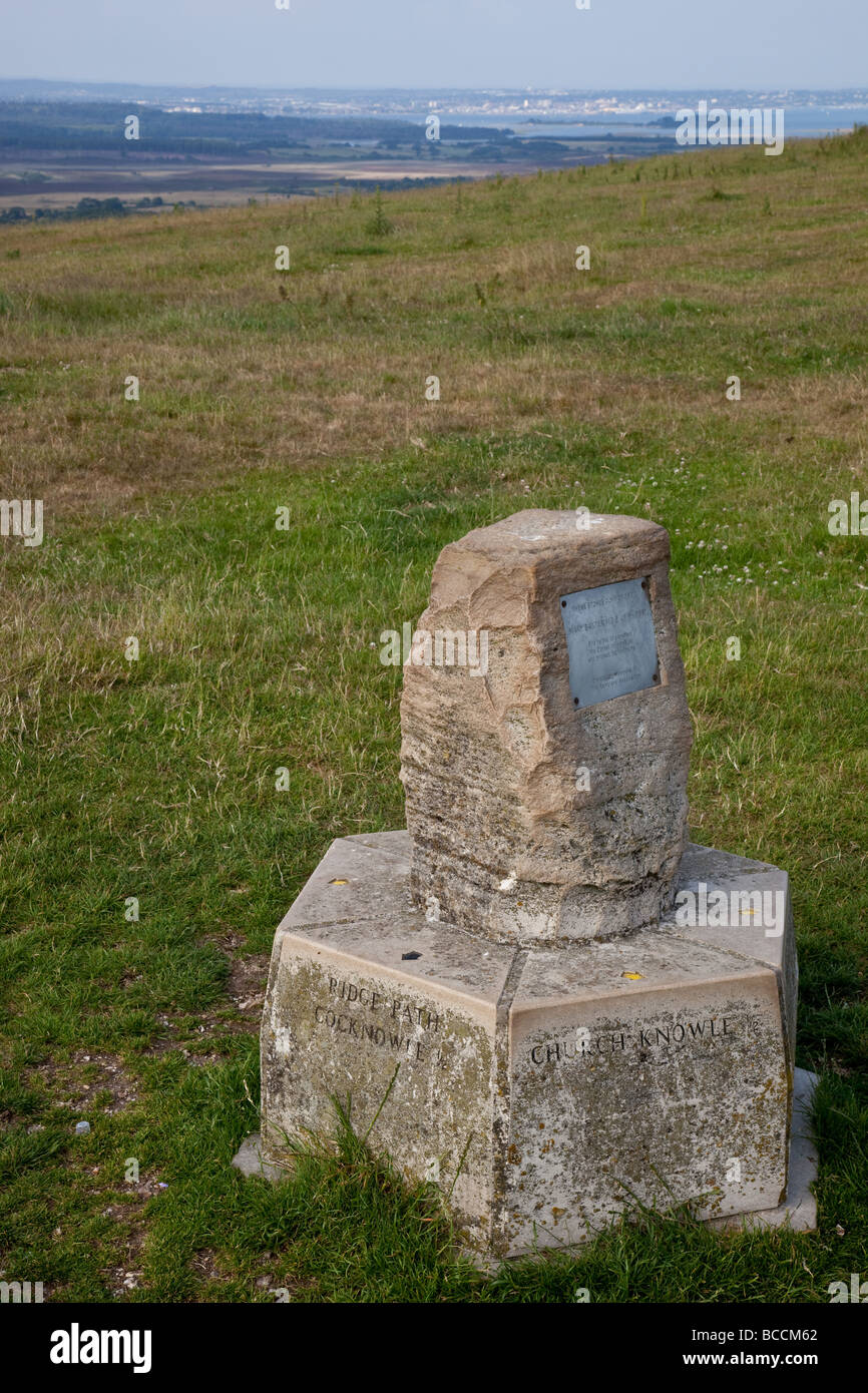 Stone Marker on the top of the Purbeck Hill ridge with Poole Harbour in ...
