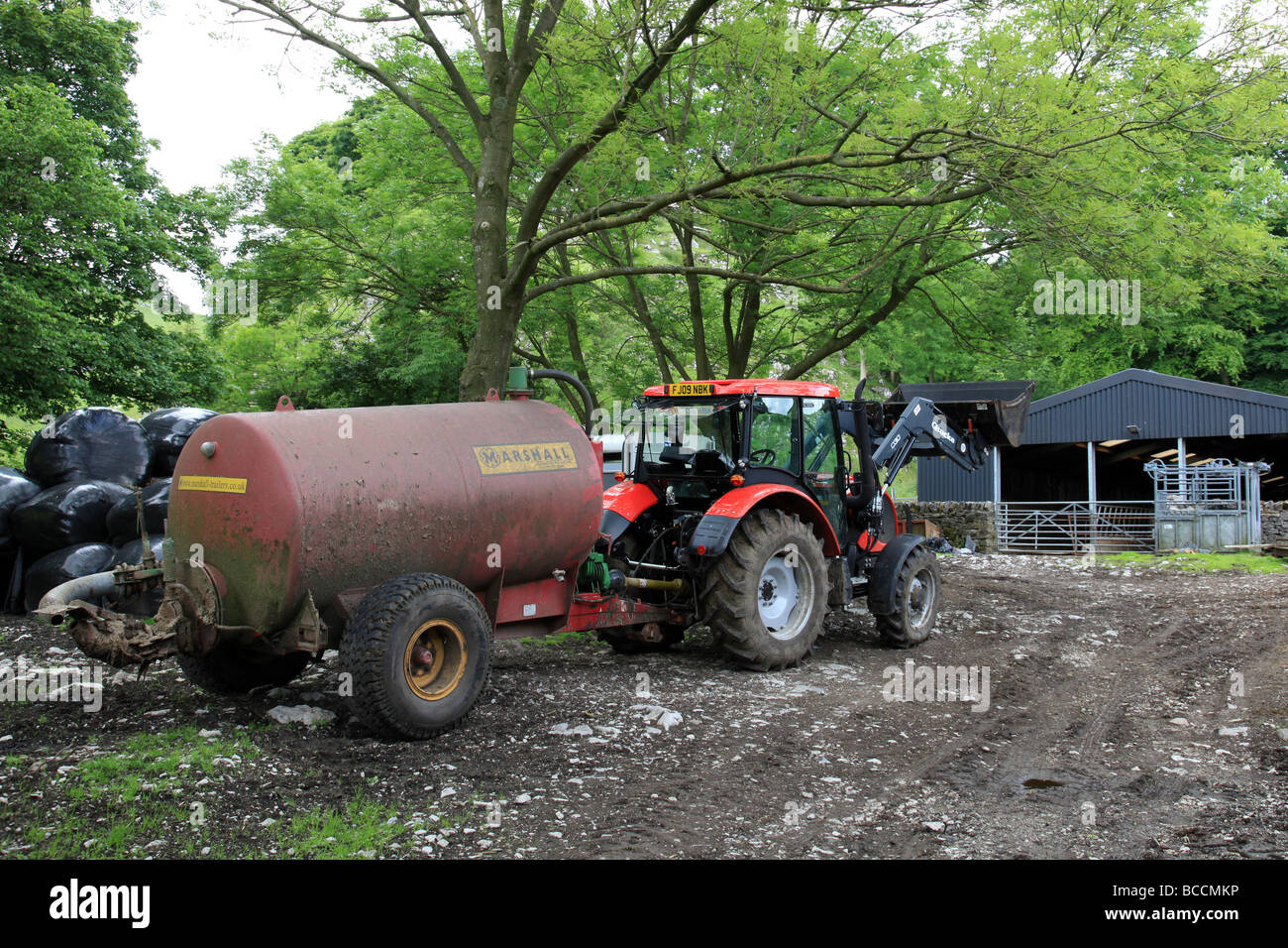 tractor on a farm Stock Photo - Alamy