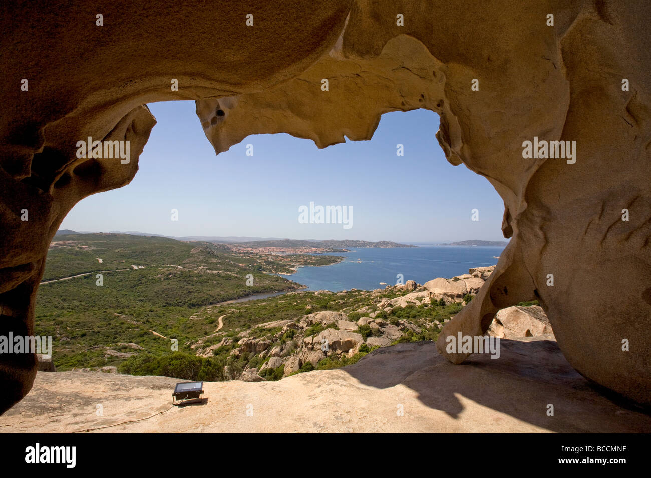 View from underneath the wind sculpted Bear rock at Capo D'Orso towards ...