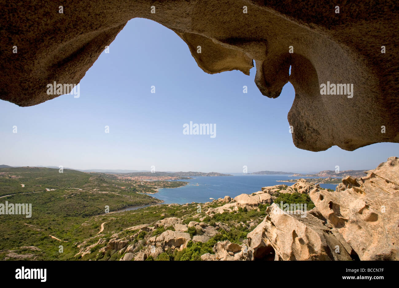 View from underneath the wind sculpted Bear rock at Capo D'Orso towards ...