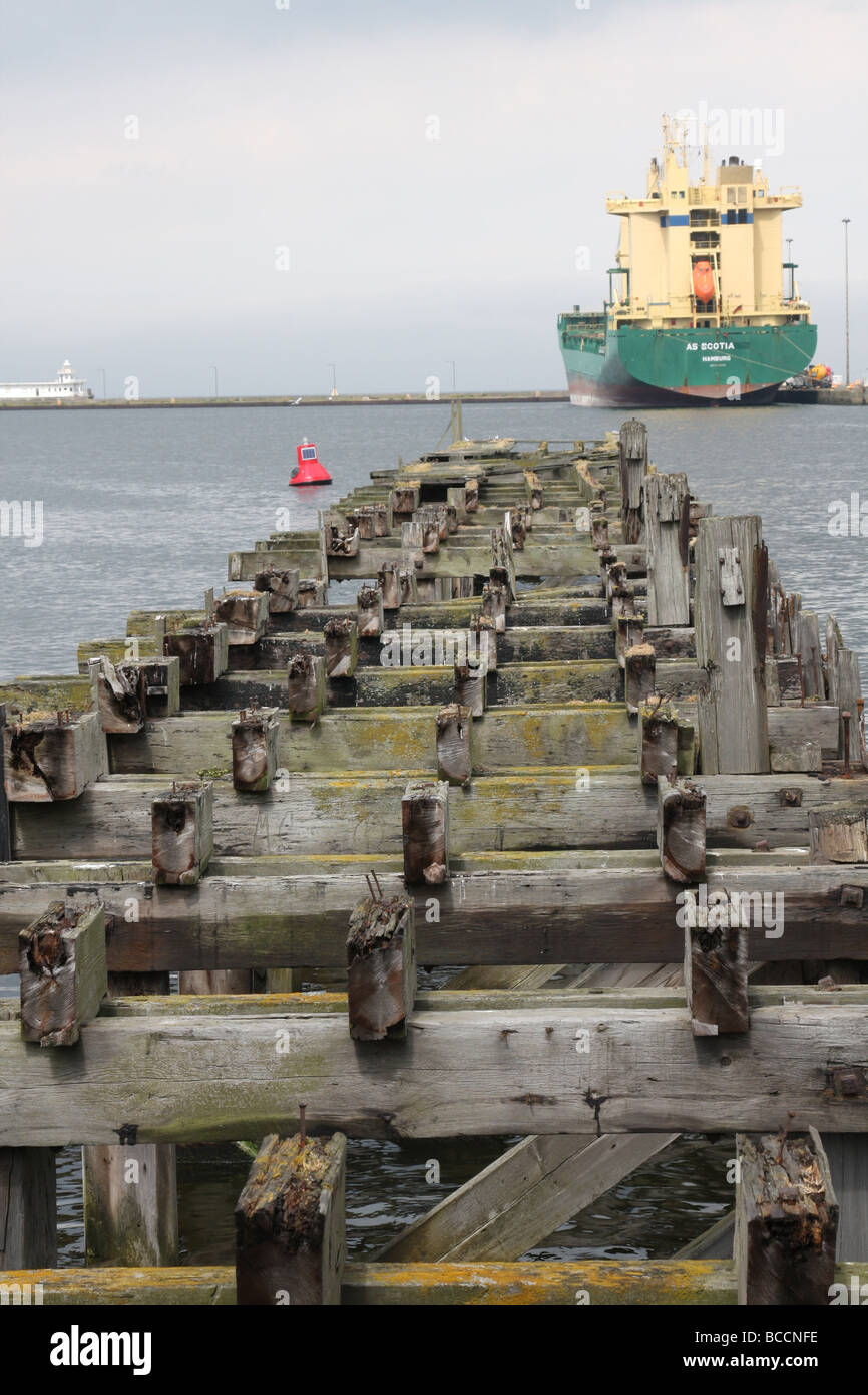 Leith Docks old wooden pier and boat Stock Photo - Alamy