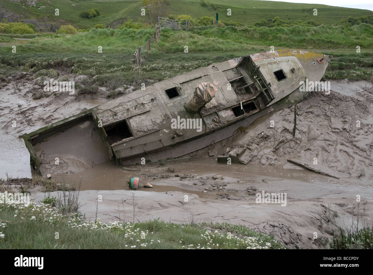 Wrecked boat, sunk in the mud at Weston Super Mare mudflats, Somerset ...