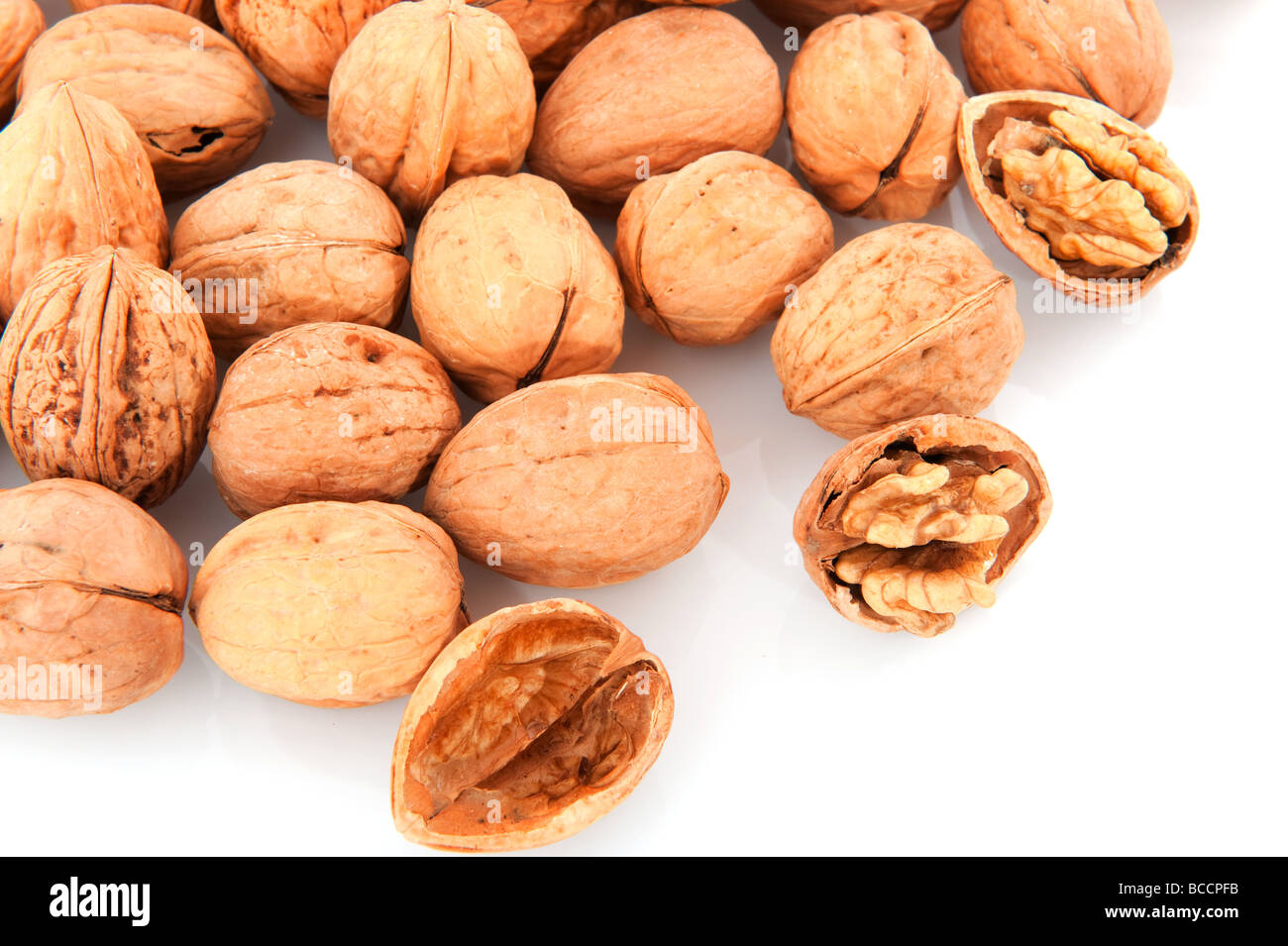 Many open and close walnuts Stock Photo - Alamy