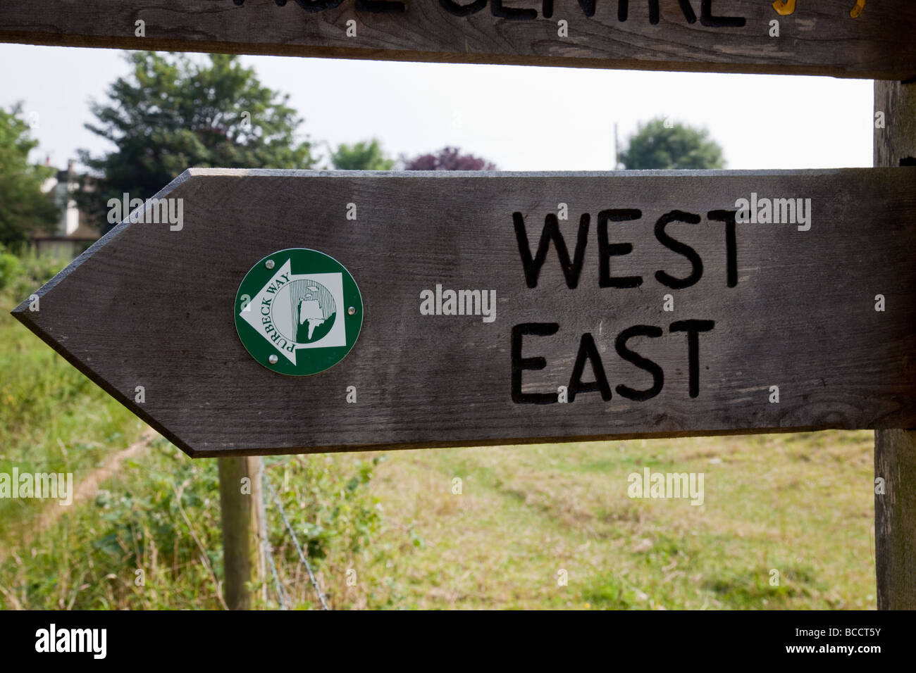 Way signpost footpath west and east in the same direction hi-res stock ...