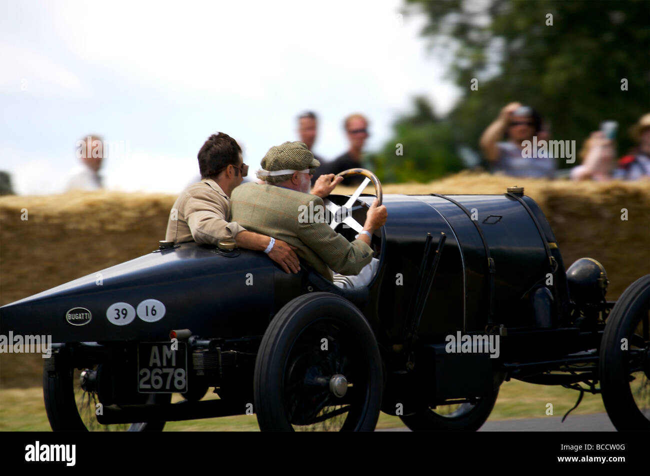 Hanging on to increase speed in a Bugatti - classic racing at Goodwood ...
