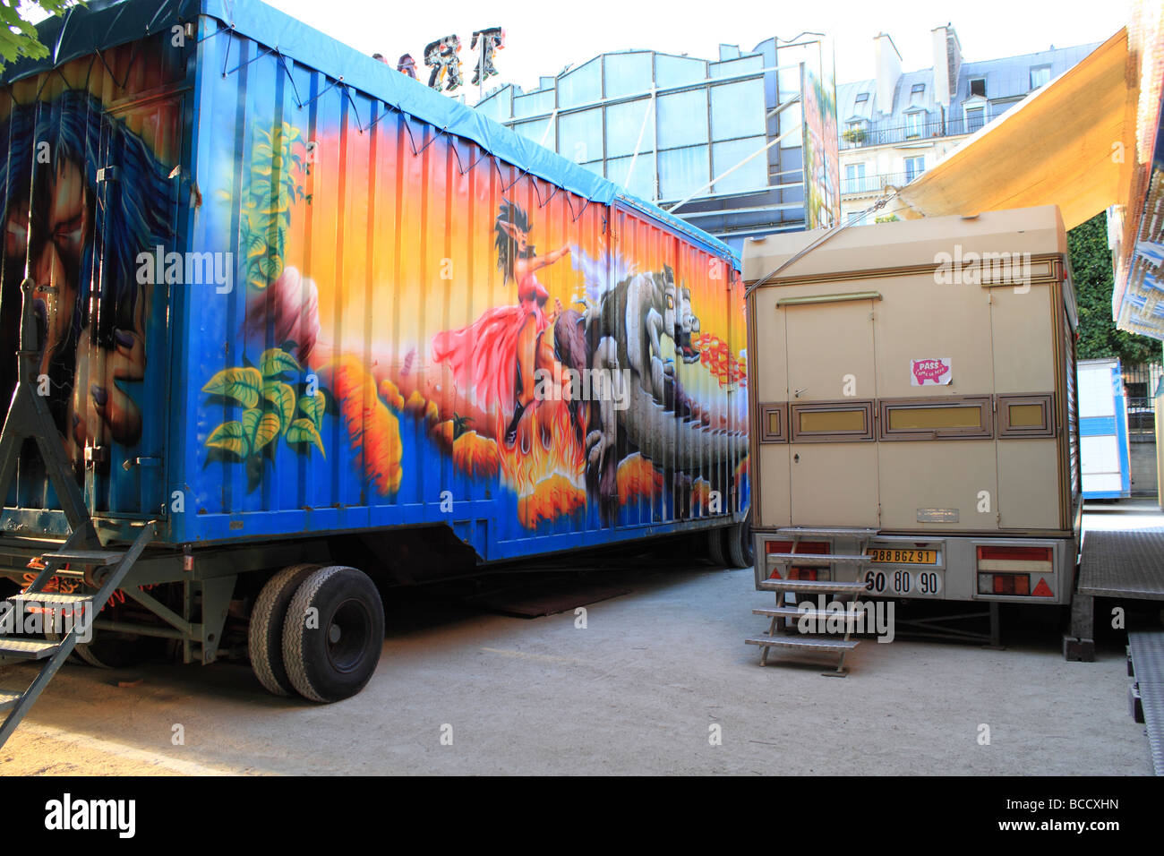 Parked Decorated Circus fairground trailer and van Stock Photo - Alamy