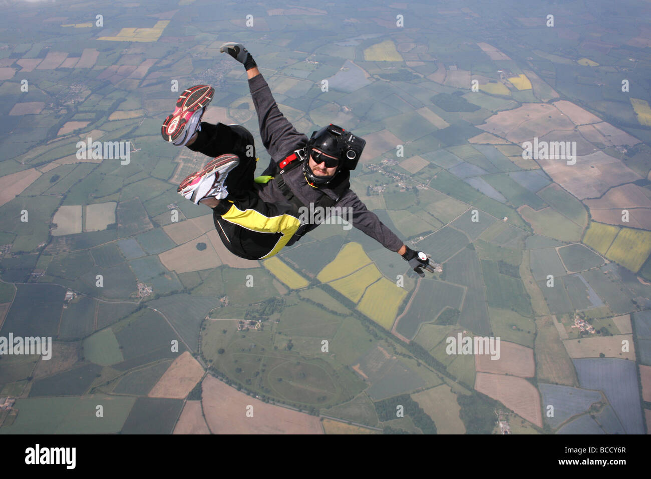 Skydiver falling through the air on his back Stock Photo - Alamy