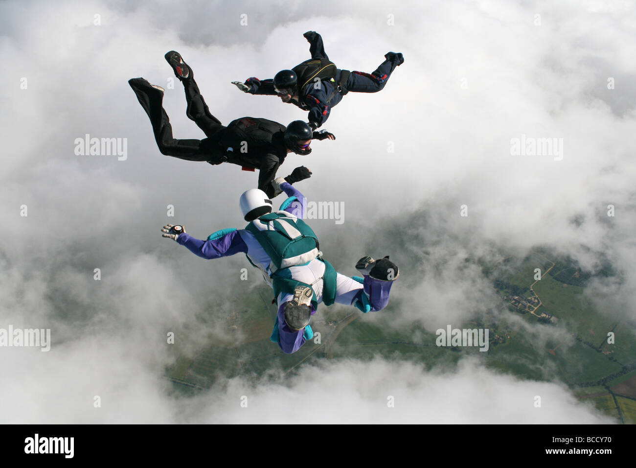 Three skydivers in freefall Stock Photo - Alamy