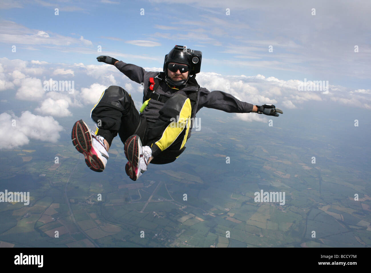 Skydiver in a sit position while in freefall Stock Photo - Alamy
