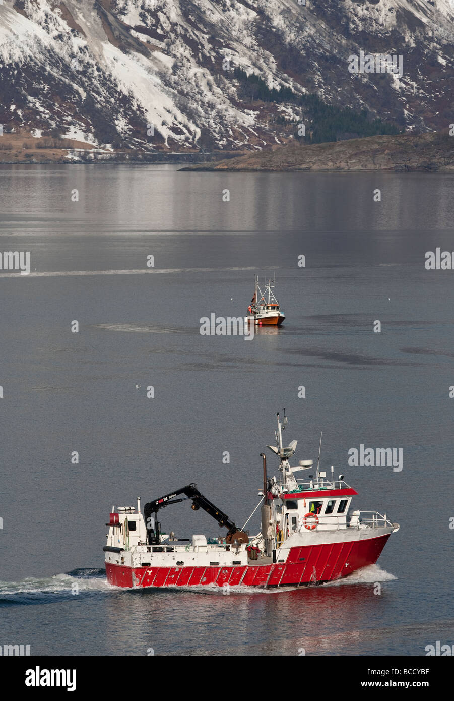 Norwegian fishing trawler and cargo vessel in Storfjord Skibotn Norway ...