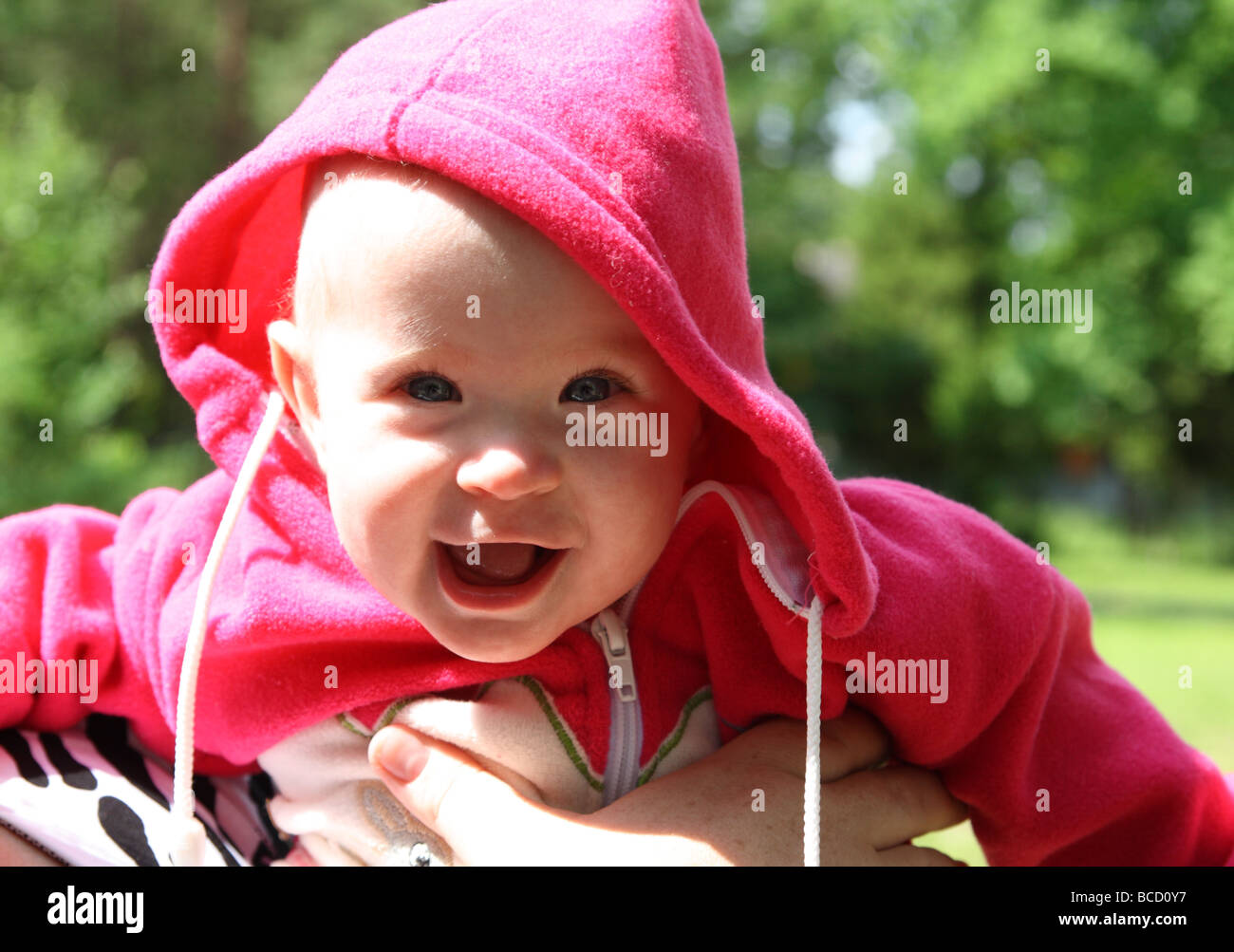 happy laughing baby outdoors under sun Stock Photo - Alamy