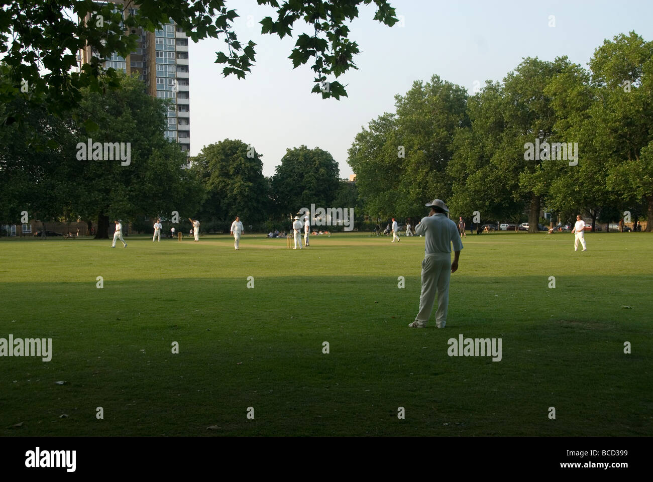 London Fields in the summer with cricket match in progress Stock Photo ...