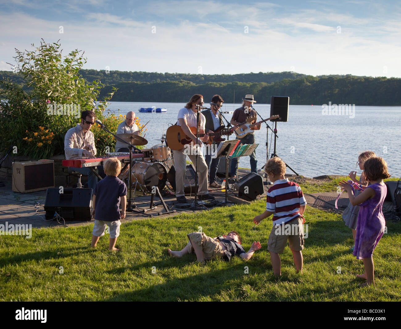 Children dancing to a musical group Stock Photo - Alamy