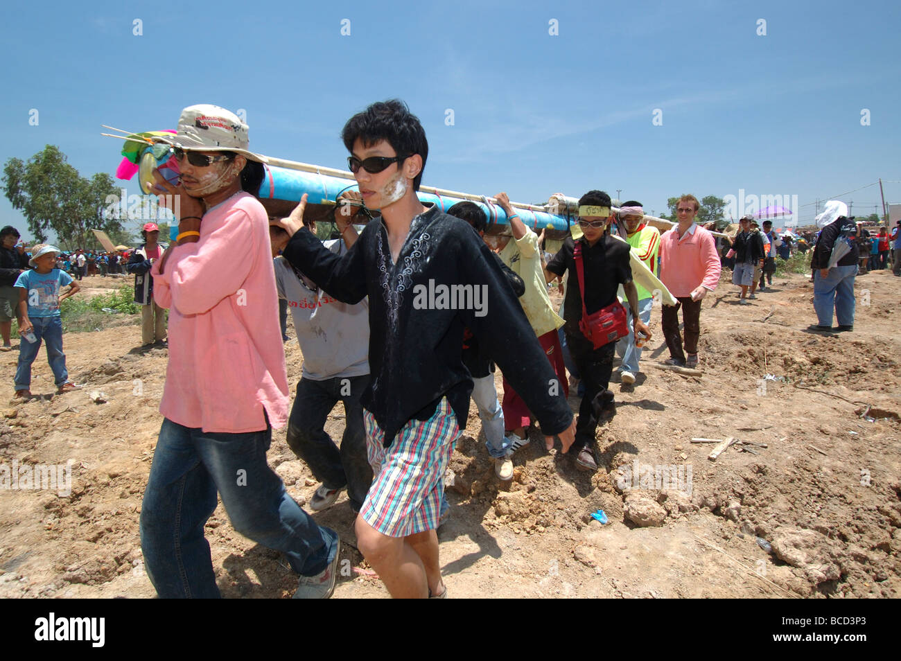 Rocket makers carry their rocket to the launch stand at the Rocket ...