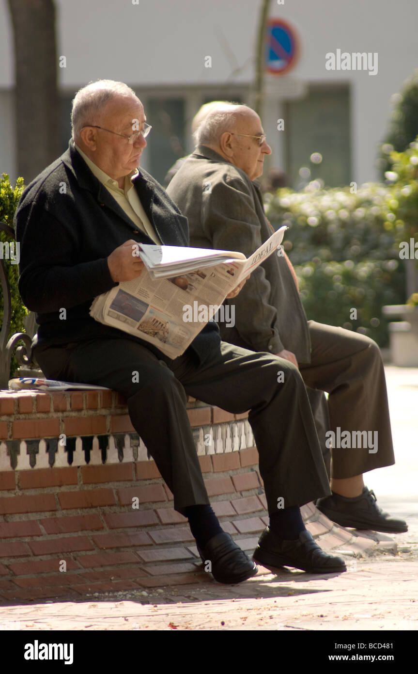 People go about their daily business in the main square of the Spanish ...