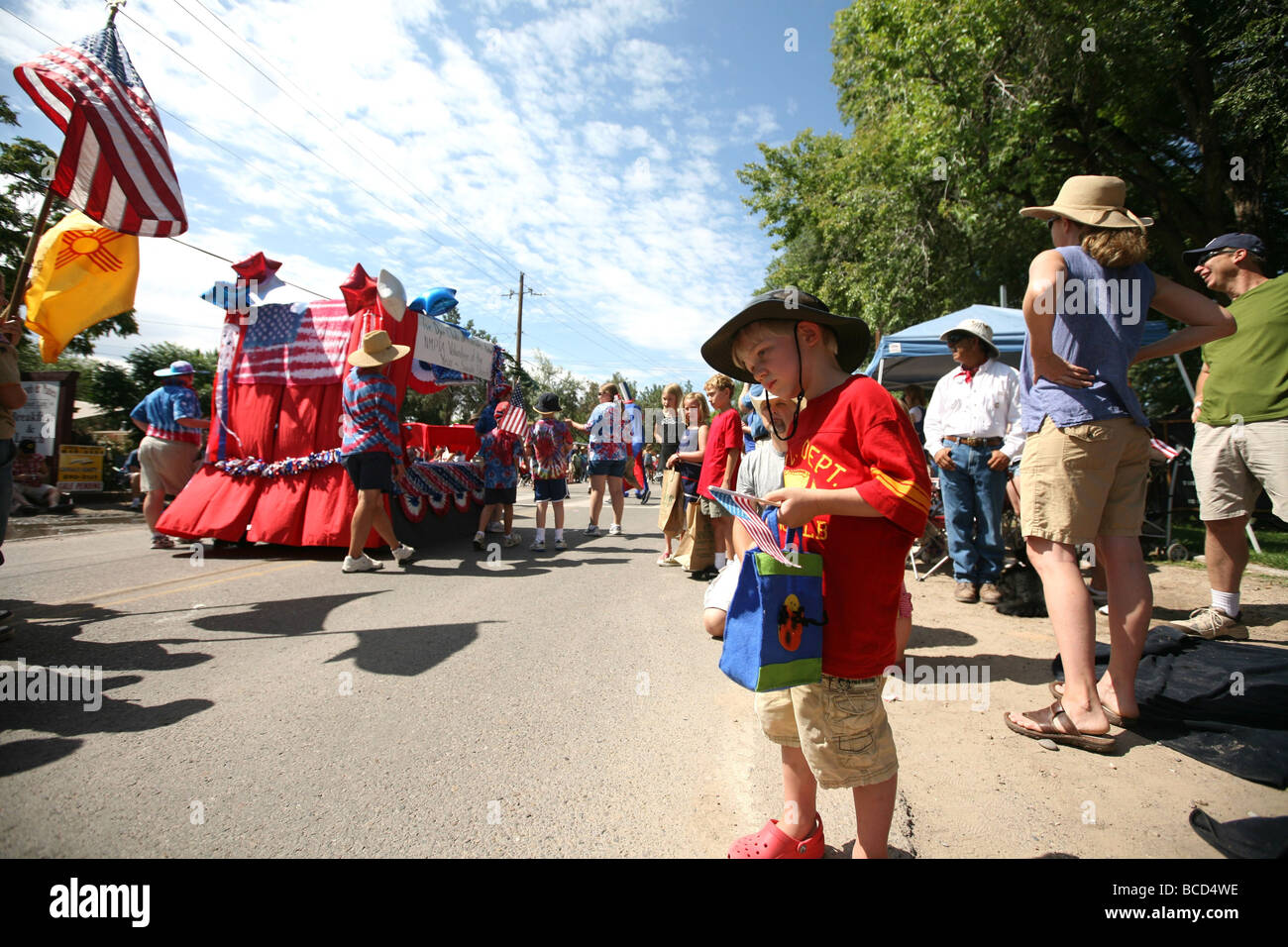 Boy looking at parade on 4th of July Stock Photo - Alamy