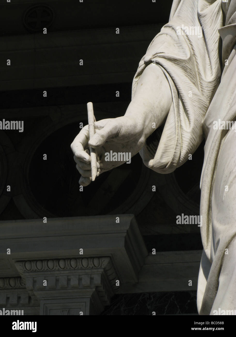 detail of statue holding pen in rome, italy Stock Photo - Alamy