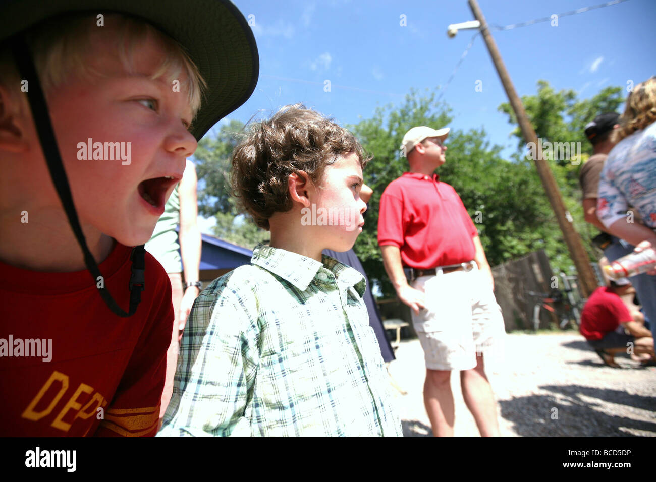 Young boy yelling at 4th of July parade Stock Photo - Alamy