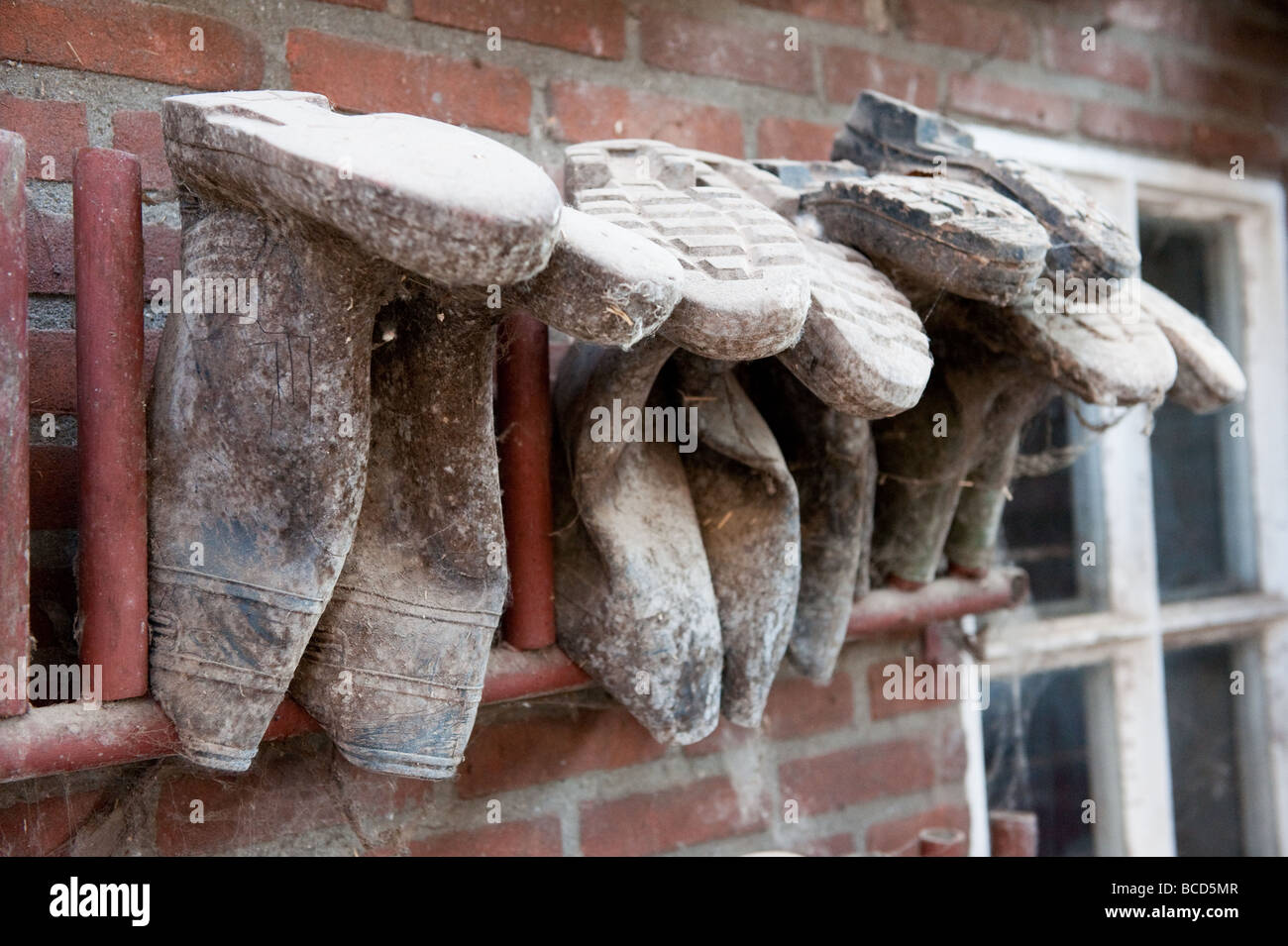 Old boots at the farm Stock Photo - Alamy