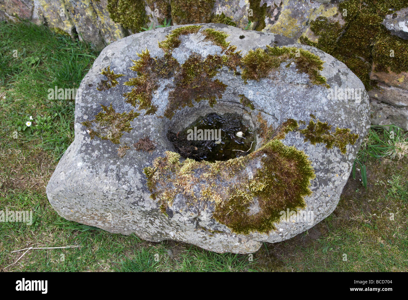 bullaun stone hollowed out stone cup at the entrance to the residence ...
