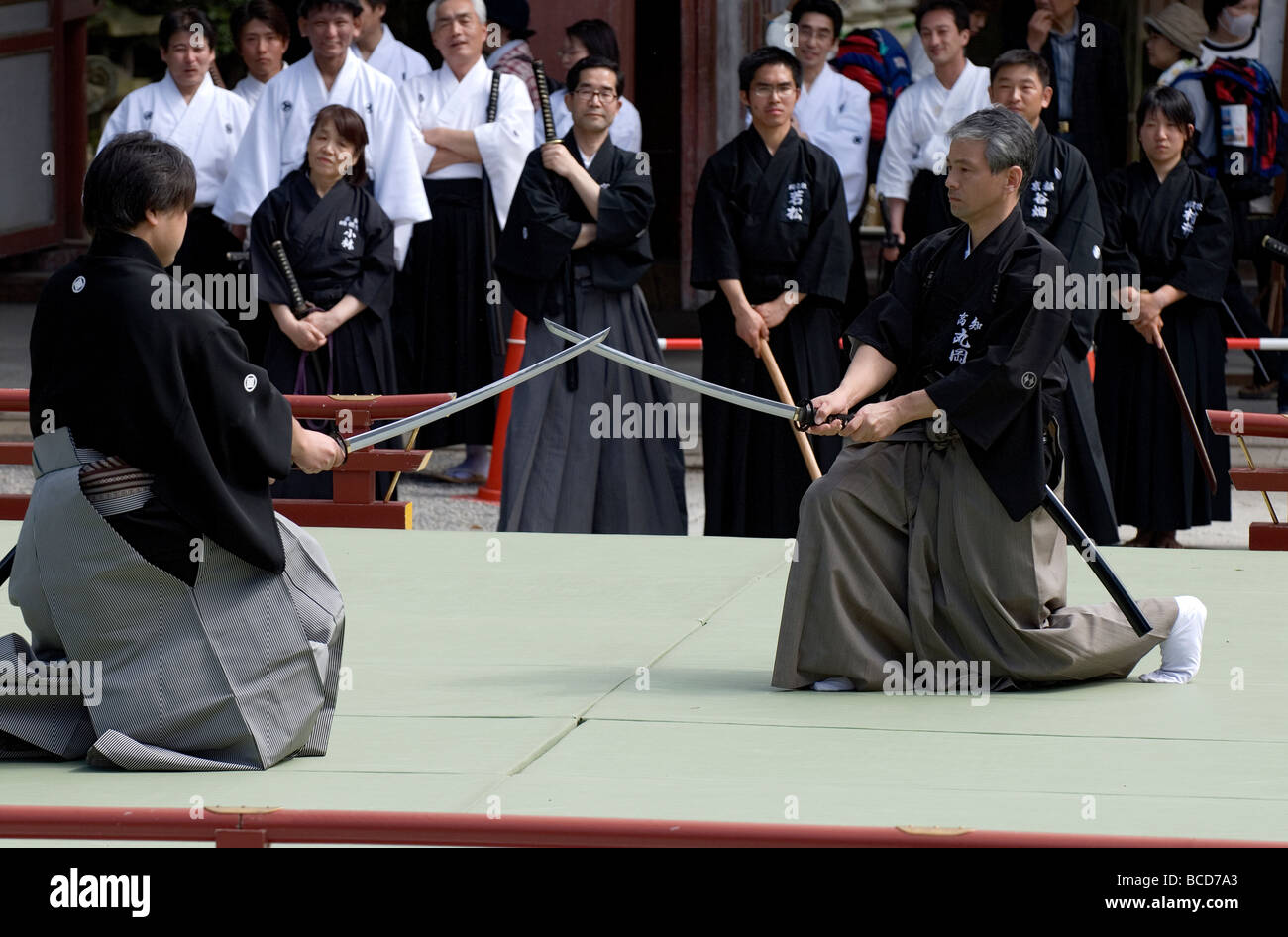 Two men sparring with real samurai swords during a swordsmanship ...