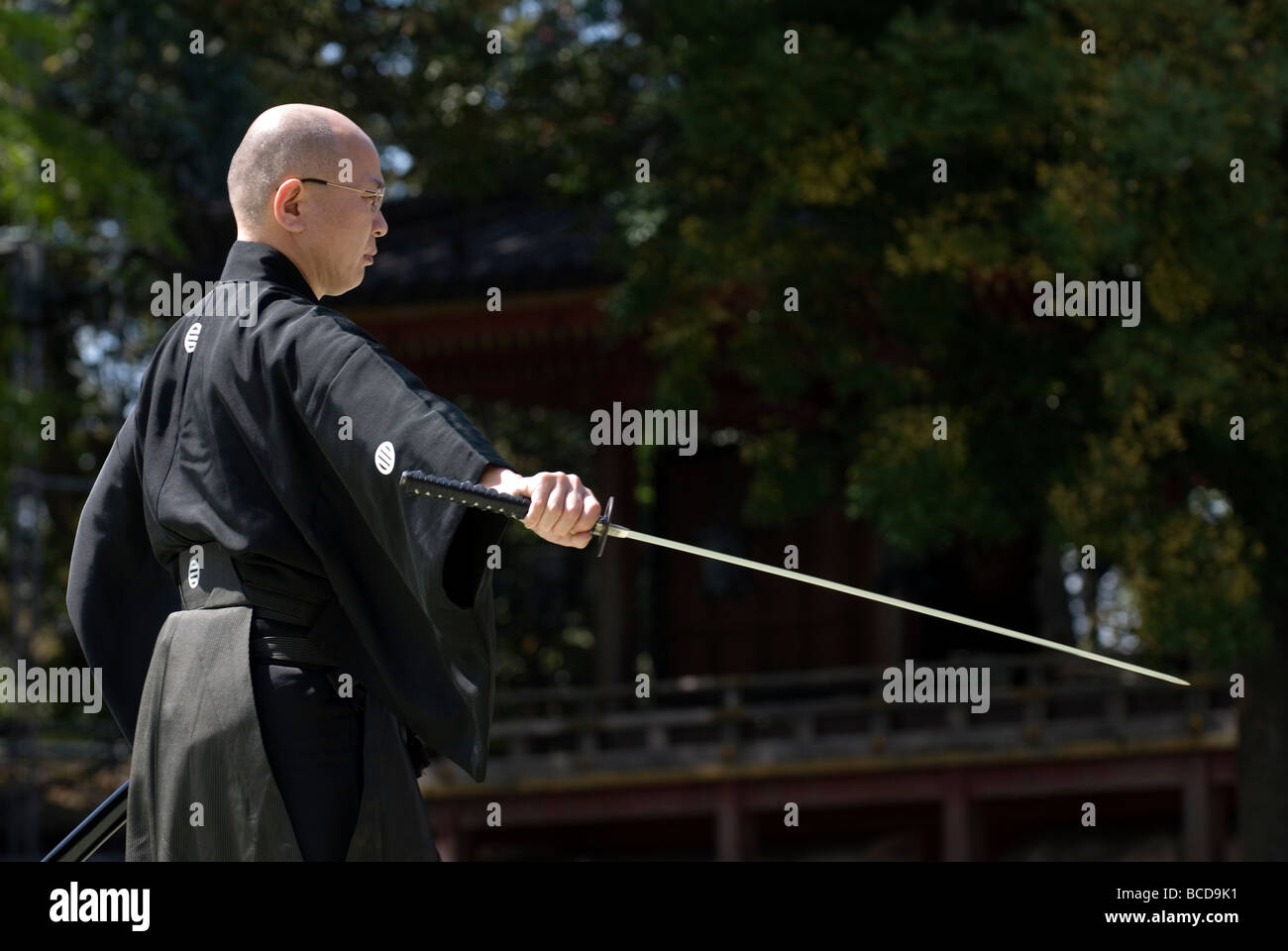 Man holding a real samurai sword during a swordsmanship exercise called ...