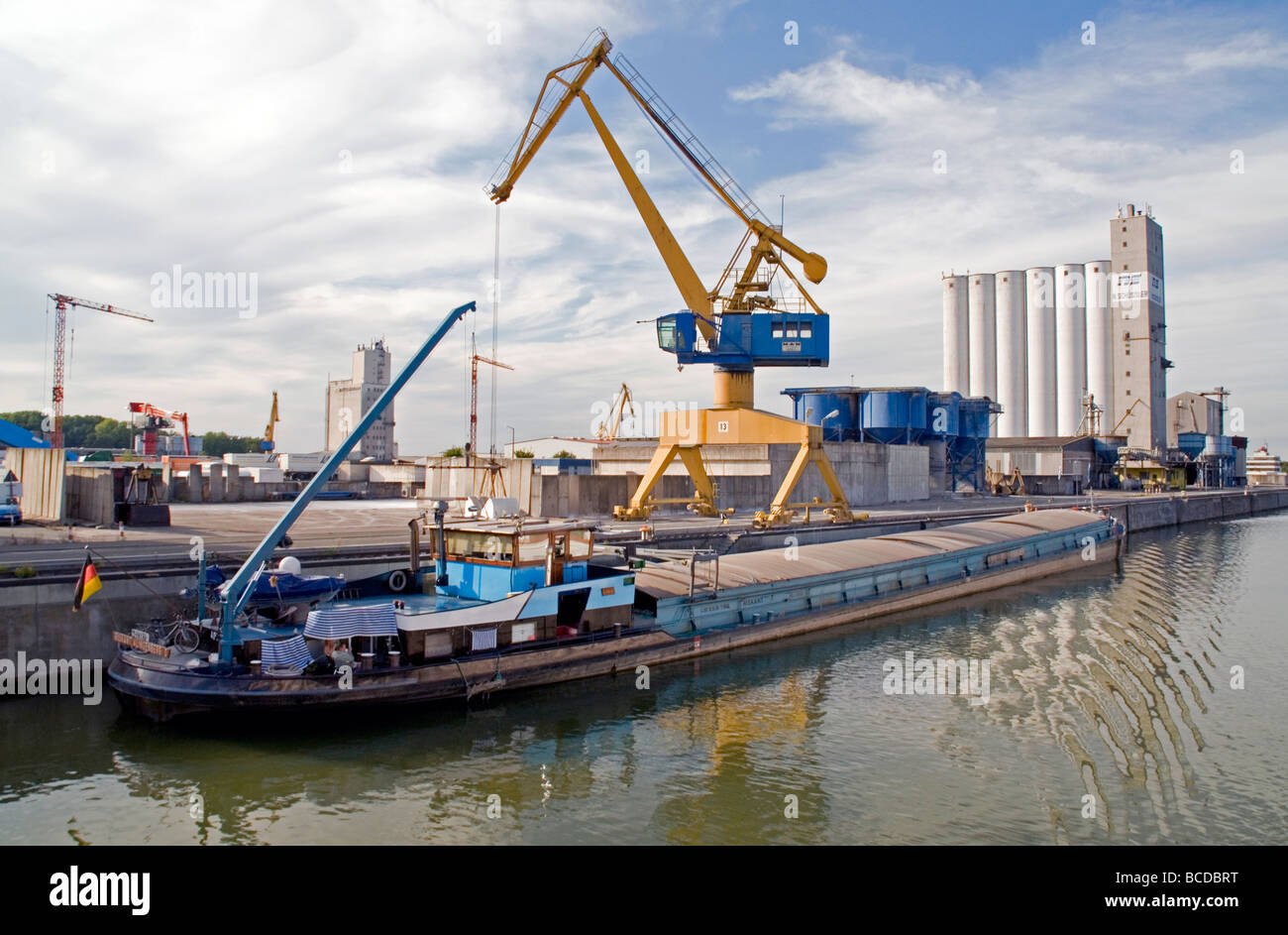 Main-Danube Canal loading dock with commercial barge in port Stock ...