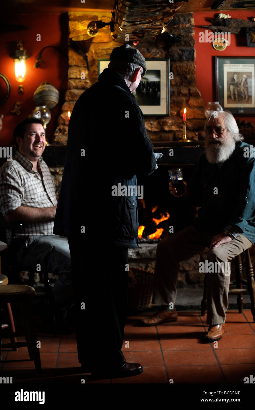 THE LANDLORD AND PATRONS OF A TRADITIONAL BRITISH PUB DRINKING BEER UK ...