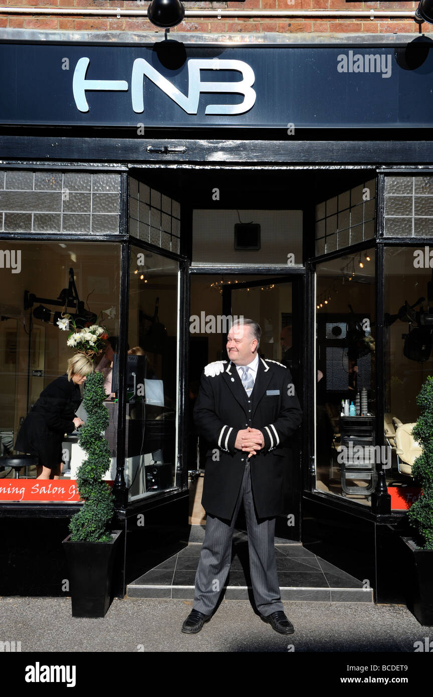 A HAIRDRESSING SALON WITH A CONCIERGE IN THE DOORWAY IN CANFORD CLIFFS ...