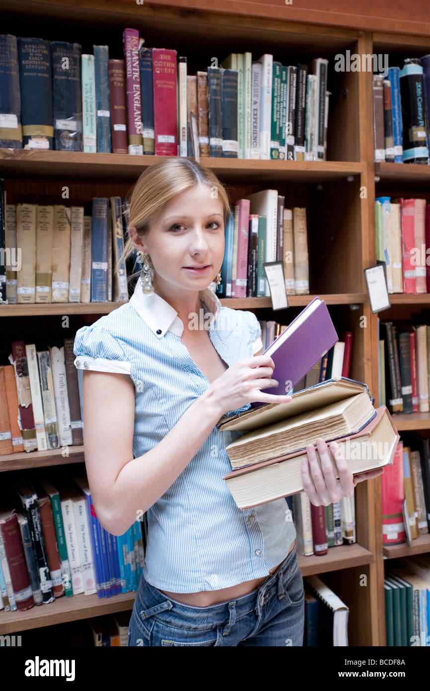 Young women in the library Stock Photo - Alamy