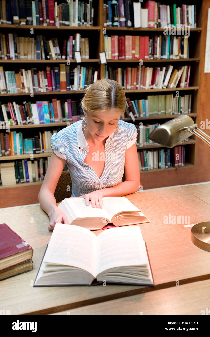 Young women in the library Stock Photo - Alamy