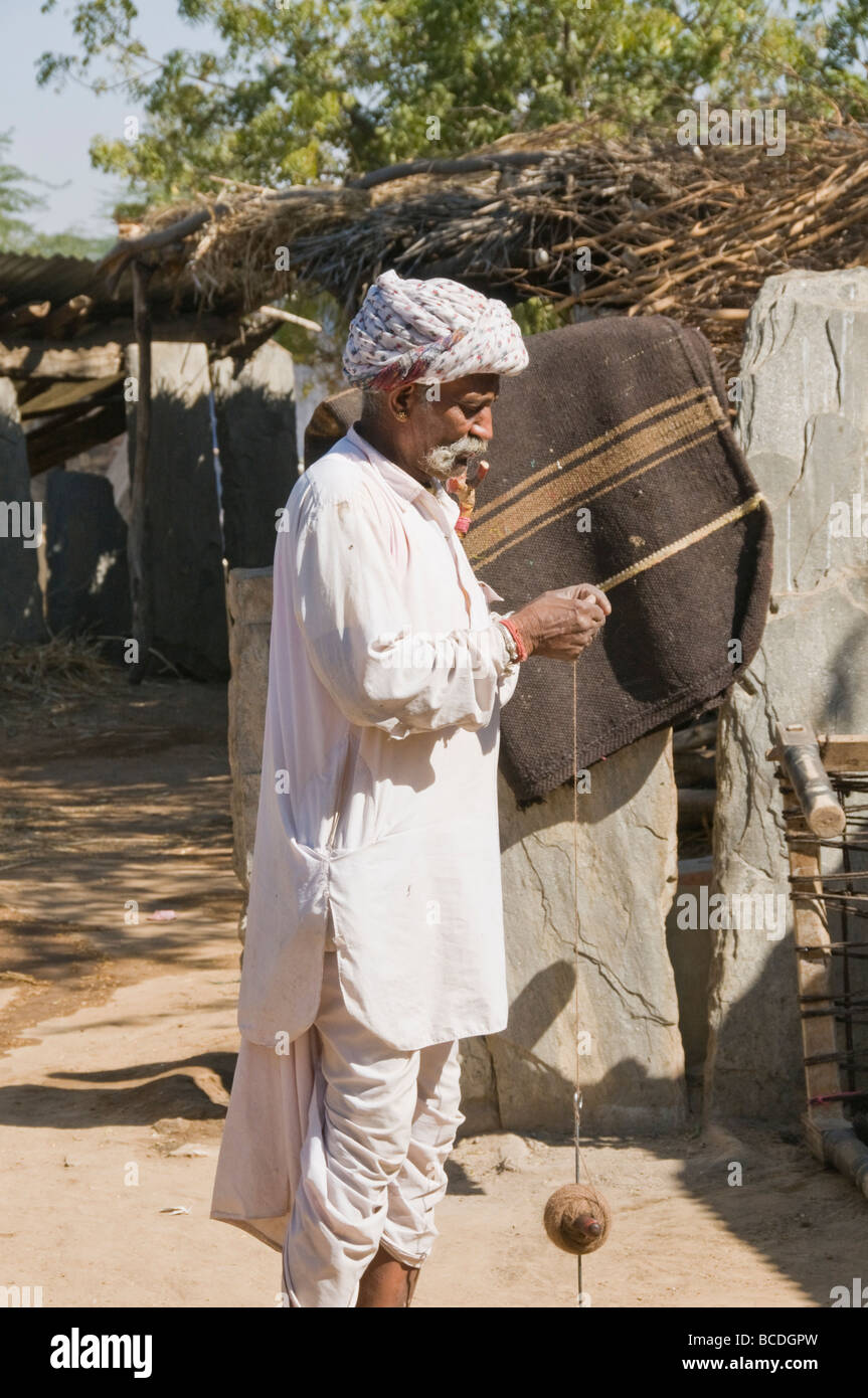 Man weaving string from camel hair hi-res stock photography and images ...