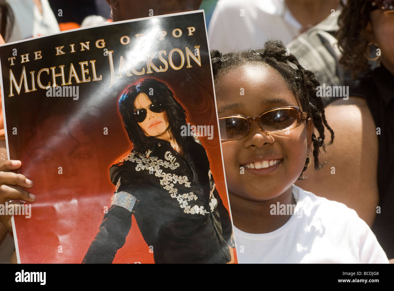 Thousands of Michael Jackson fans gather outside the Apollo Theater in ...