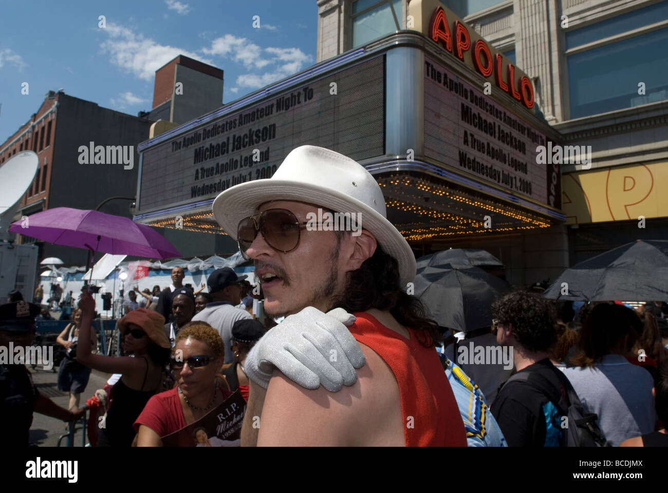 Thousands of Michael Jackson fans gather outside the Apollo Theater in ...