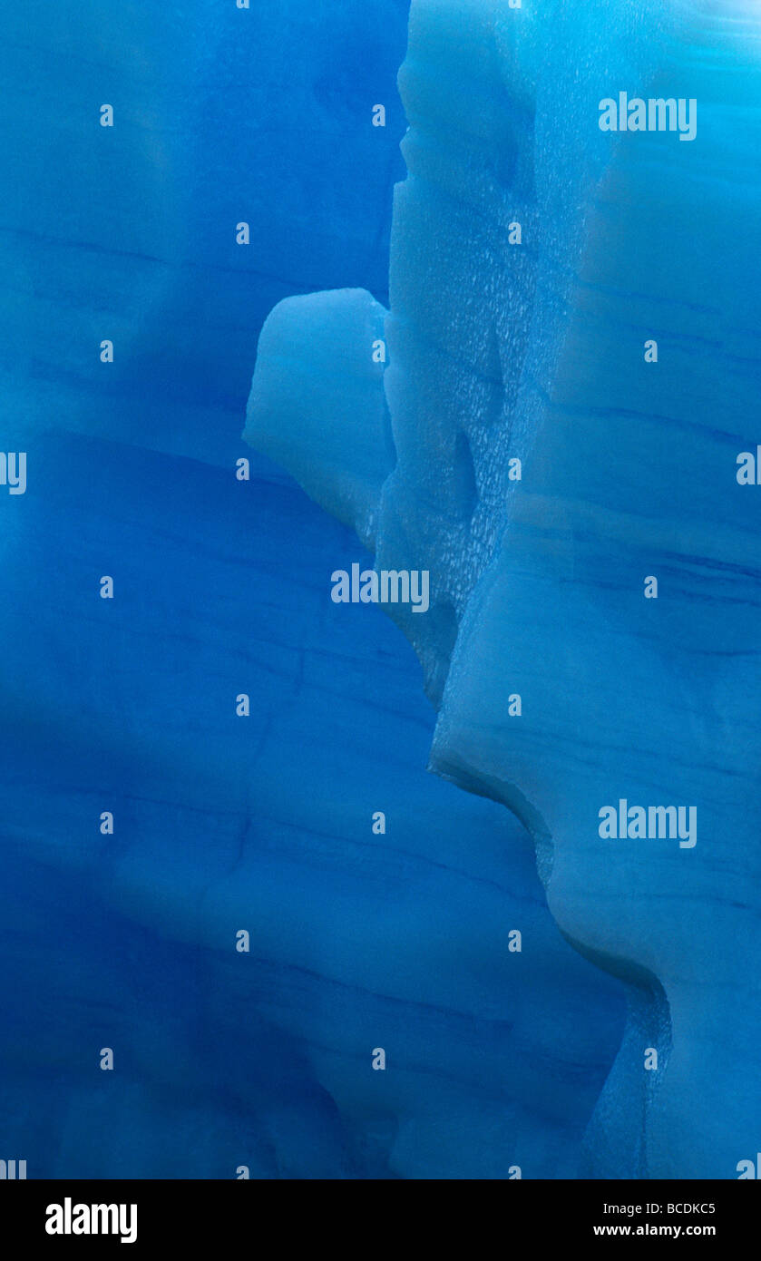 A deep blue iceberg formation of veins and pressure ridge lines Stock ...
