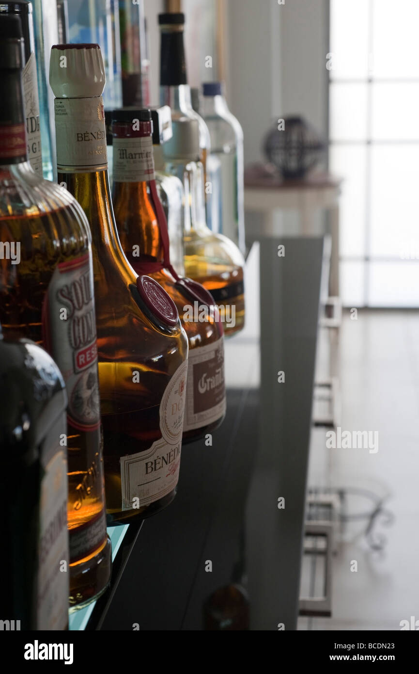 Alcohol bottles on a shelf in a bar Stock Photo - Alamy