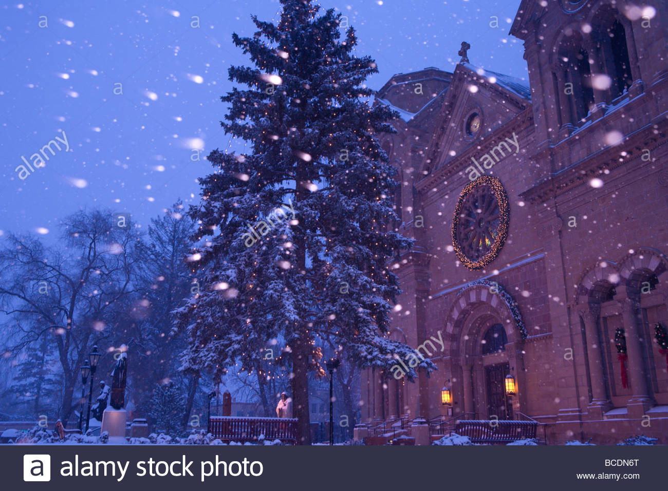 Snow falls on a city scene Stock Photo - Alamy