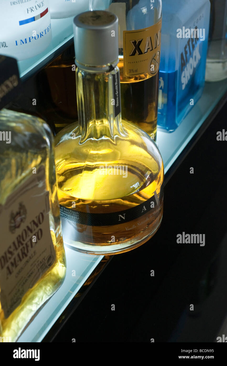 Alcohol bottles on a shelf in a bar Stock Photo - Alamy