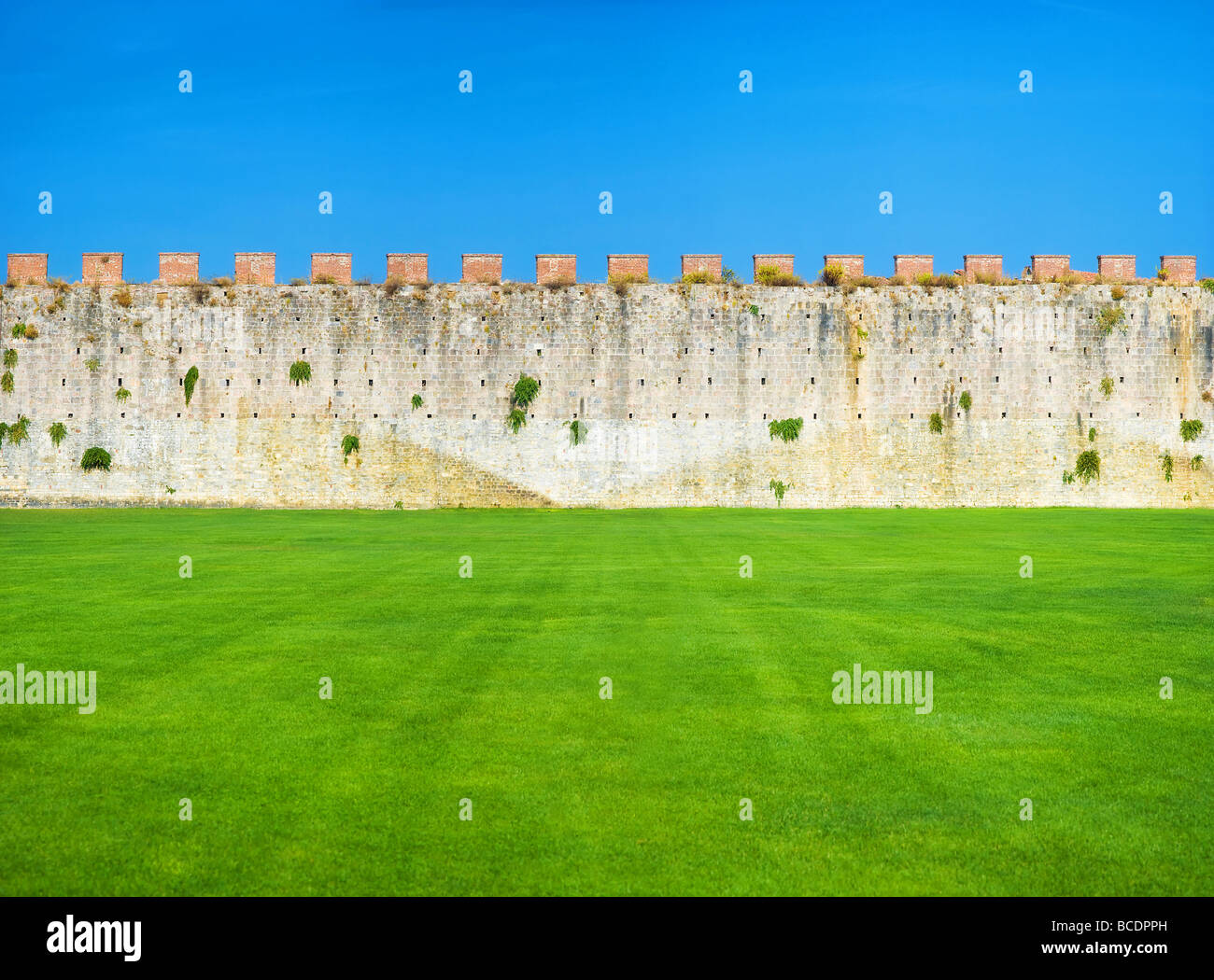 Ancient wall blue sky and green grass Stock Photo - Alamy