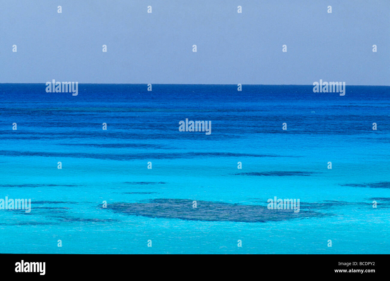 Rich turquoise seas and coral reefs surround remote tropical islands ...