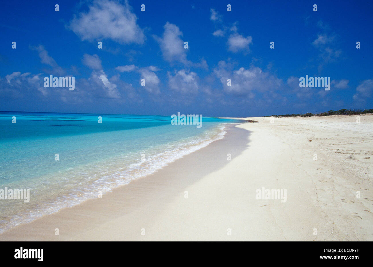 Rich turquoise seas and coral reefs surround remote tropical islands ...