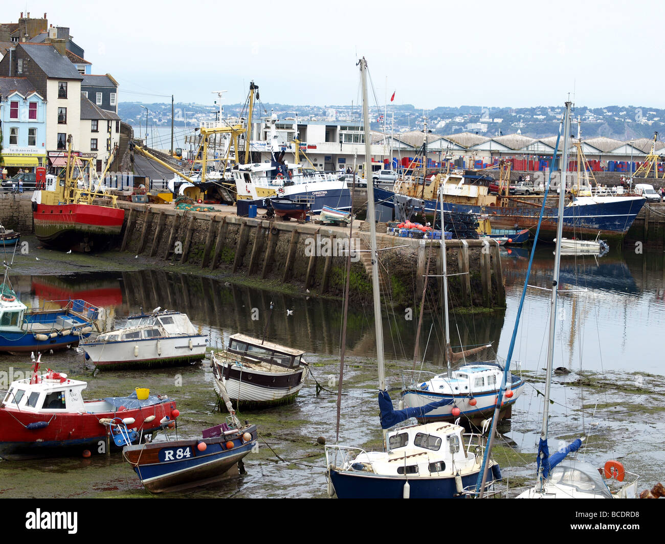 The inner harbour and main harbour quay at low tide,at Brixham,Devon ...