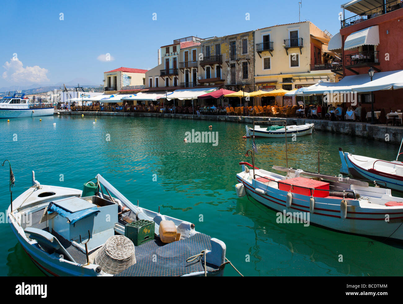 Waterfront Restaurants and Fishing Boats in the Old Venetian Harbour ...