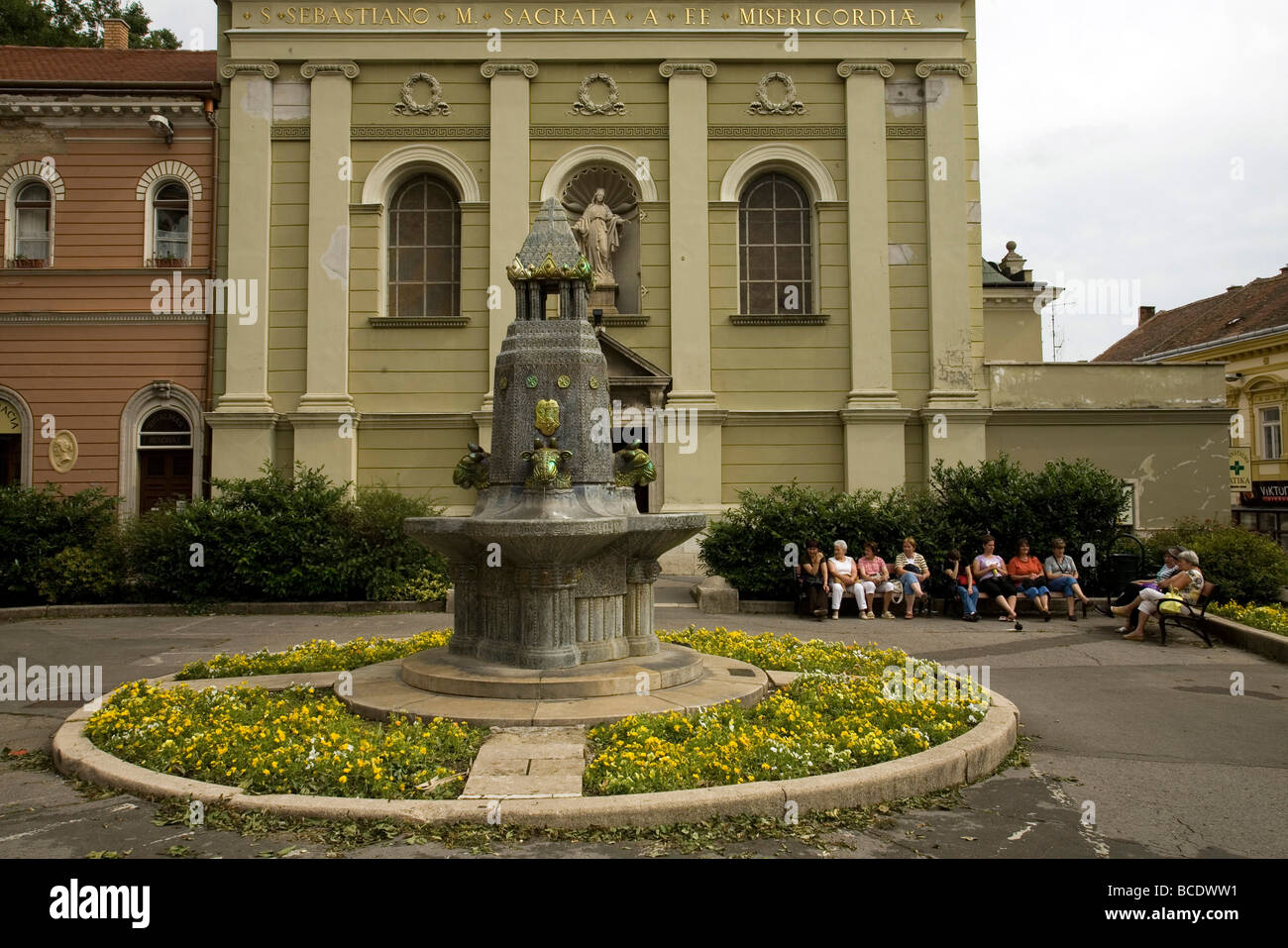 Women sit and talk by the Zsolnay Fountain Pecs Hungary Pecs has been ...