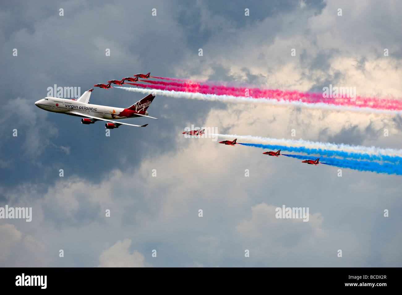 Virgin 747 Aircraft with The Red Arrows in formation during a flypast ...