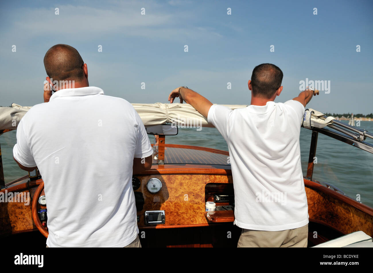 Italian man navigating in the sea, Venice, Italy Stock Photo - Alamy