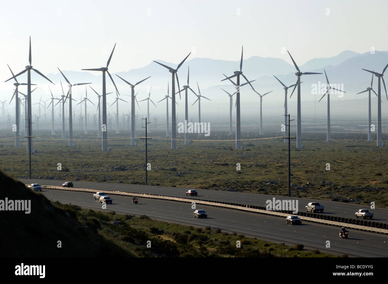 Windmills along highway Stock Photo - Alamy