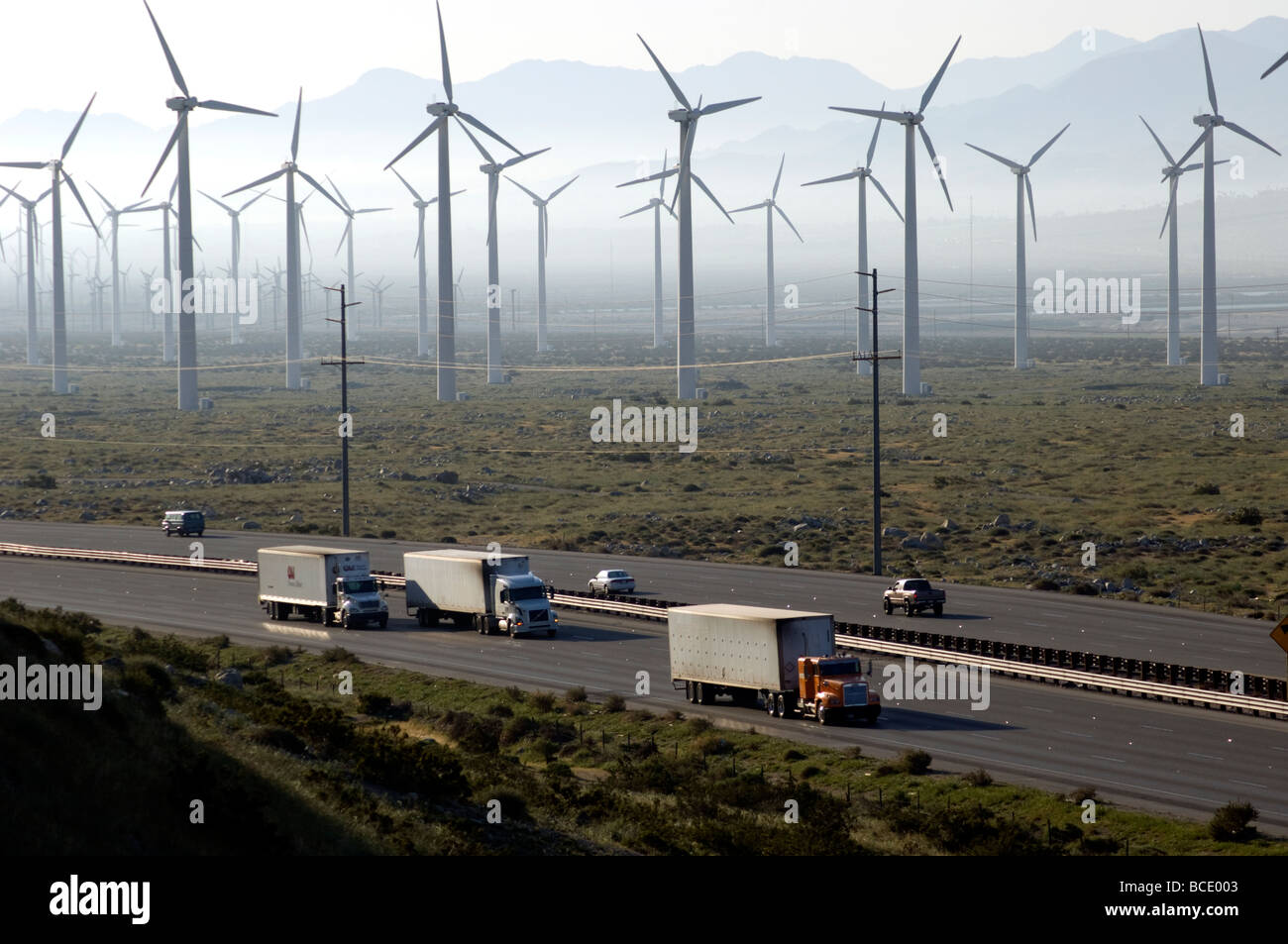 Windmills along highway Stock Photo - Alamy