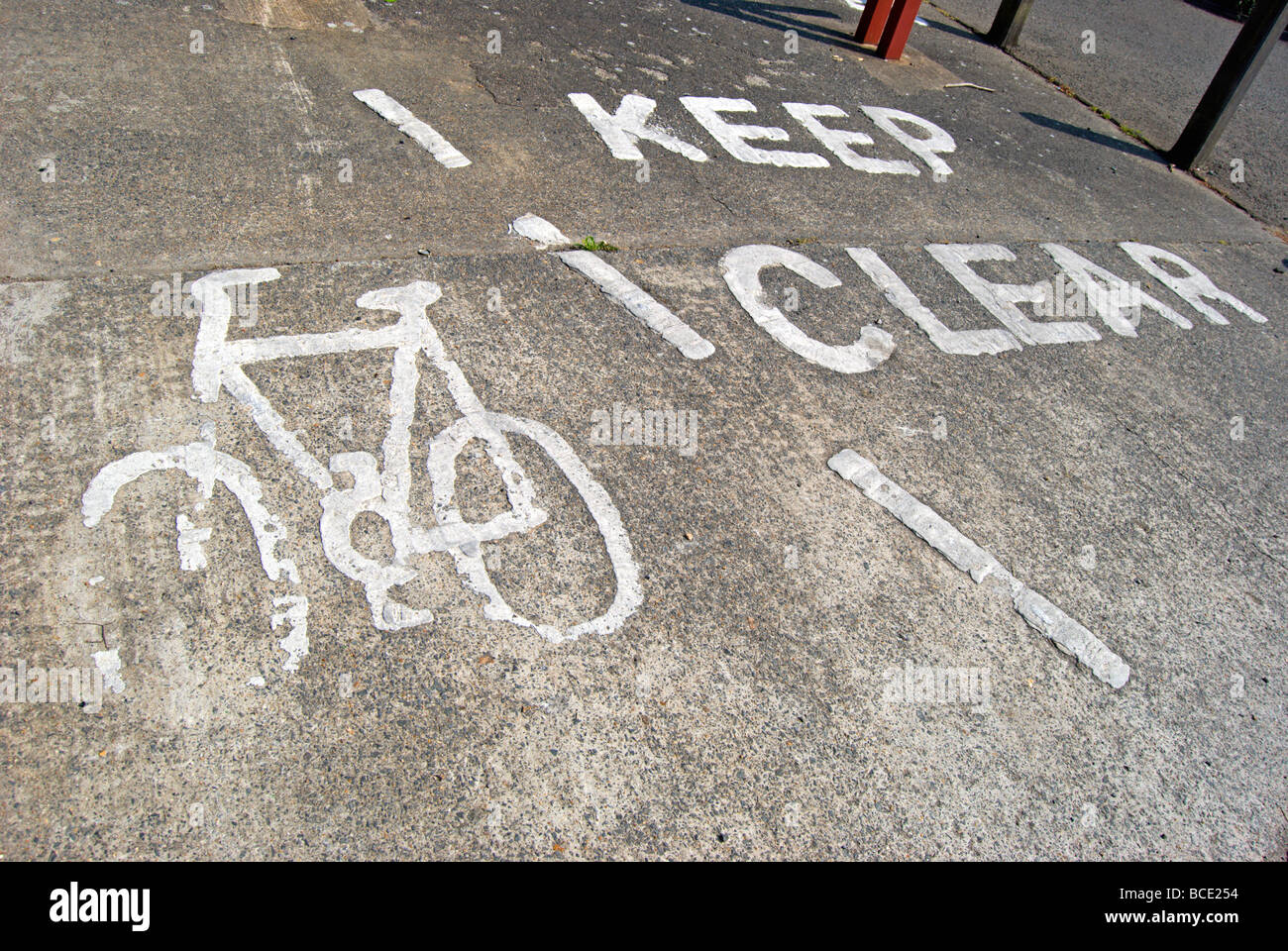 road markings with the words keep clear and an image of a bicycle to ...